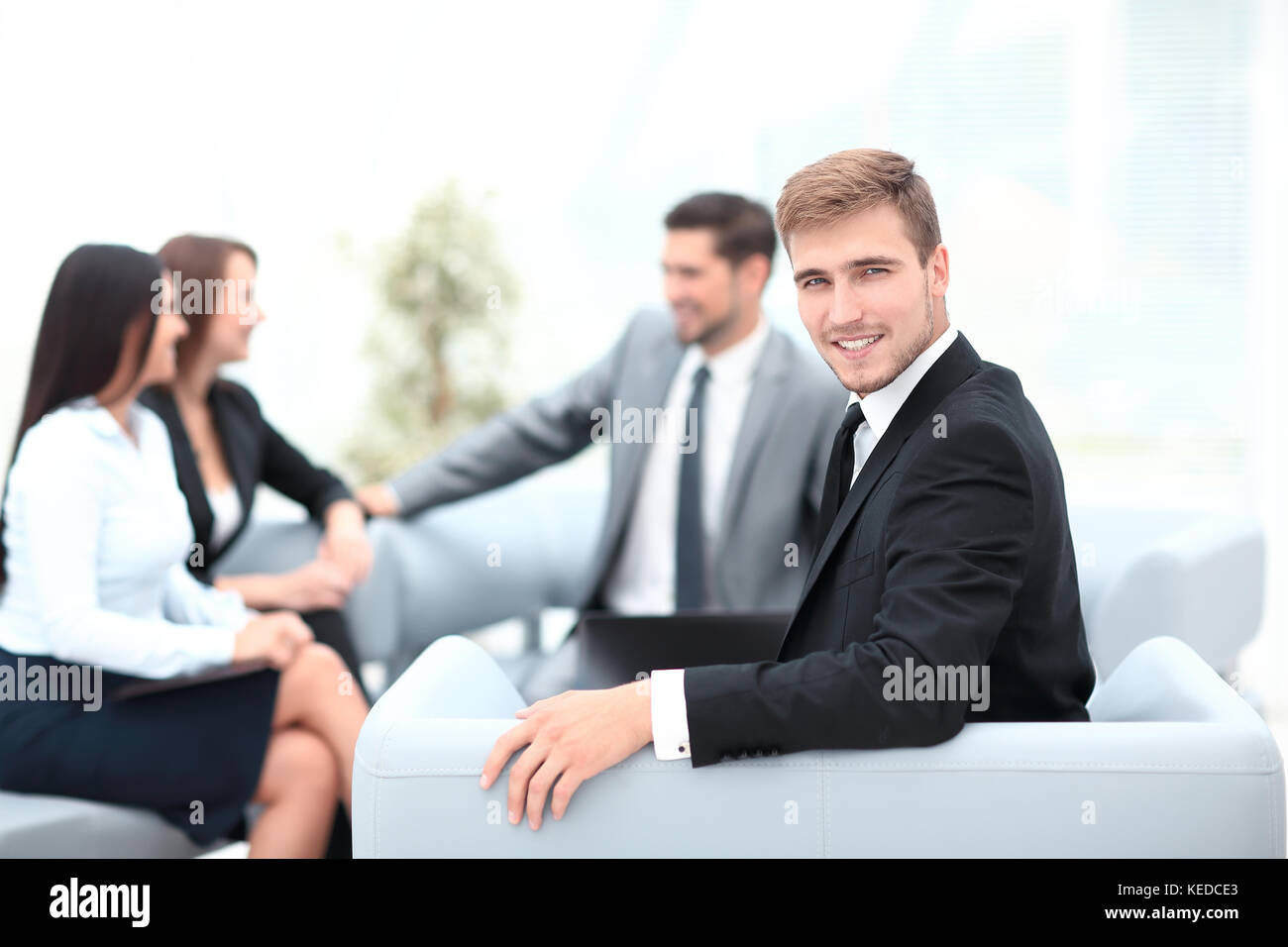 successful business man at the office on the background of business ...