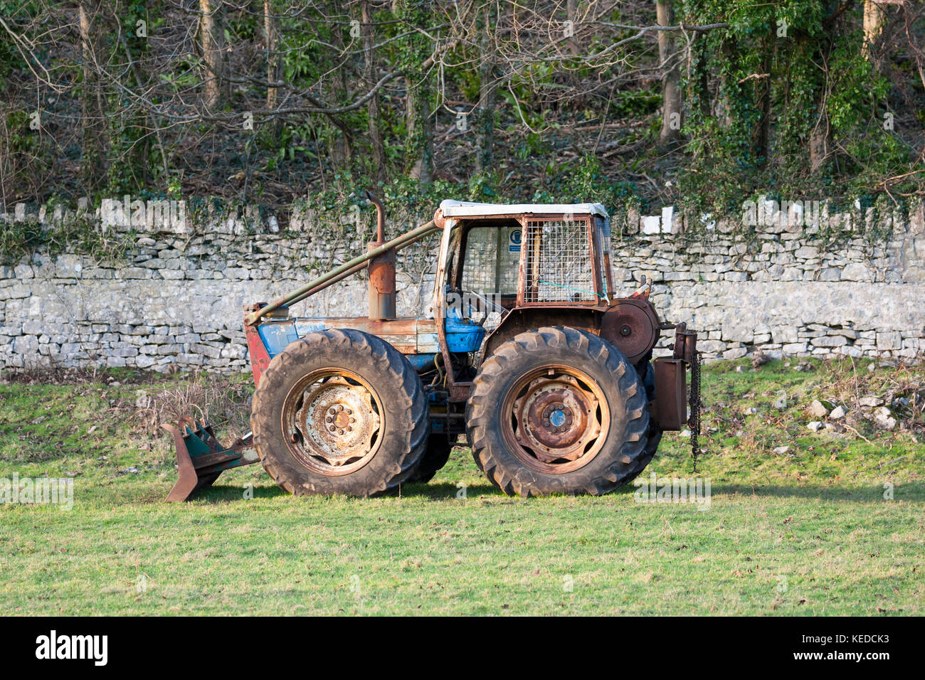 vintage Ford County tractor used for pulling wood Stock Photo - Alamy