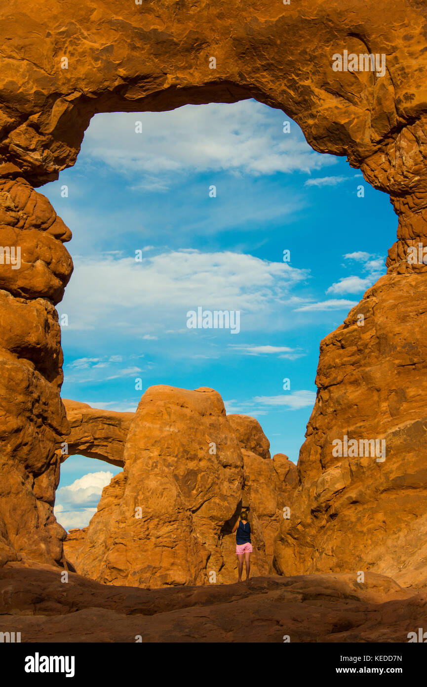 South window arch seen from a girl through Turret arch, Arches National ...
