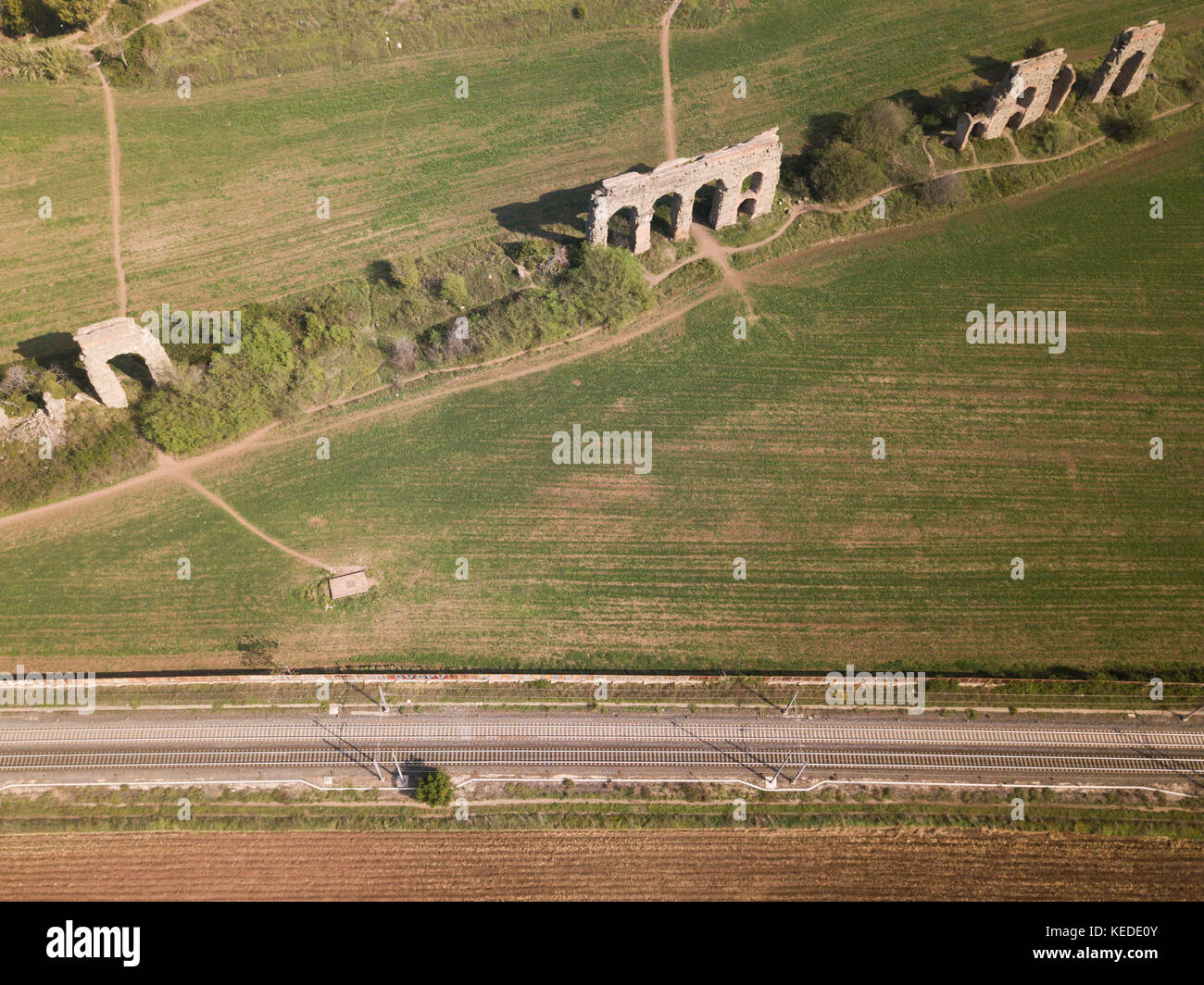 Aerial view of a railways that passes in the middle of the ancient ...