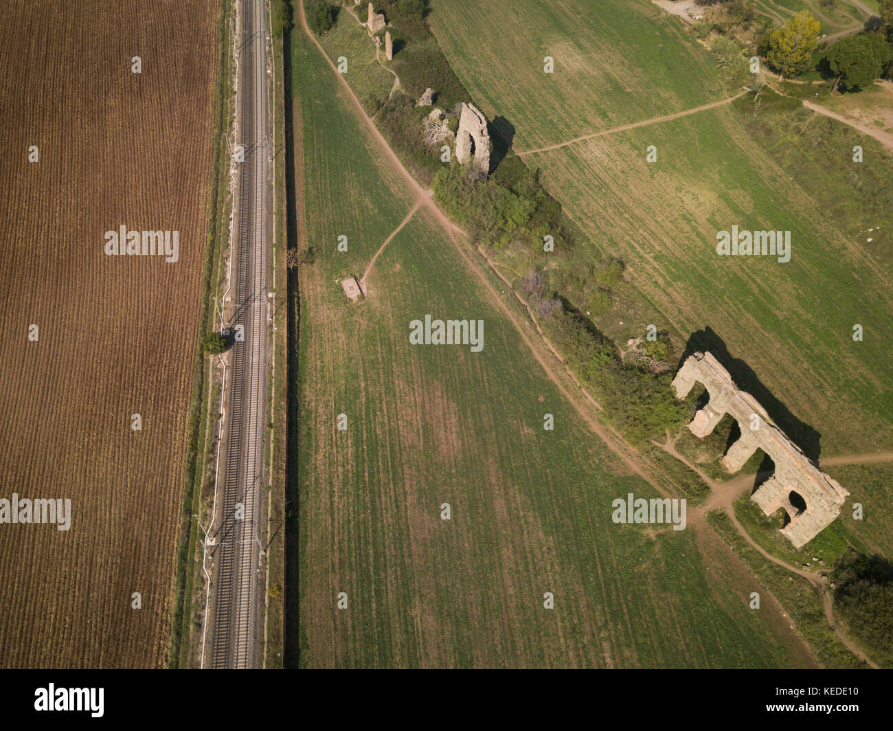 Aerial view of a railways that passes in the middle of the ancient ...
