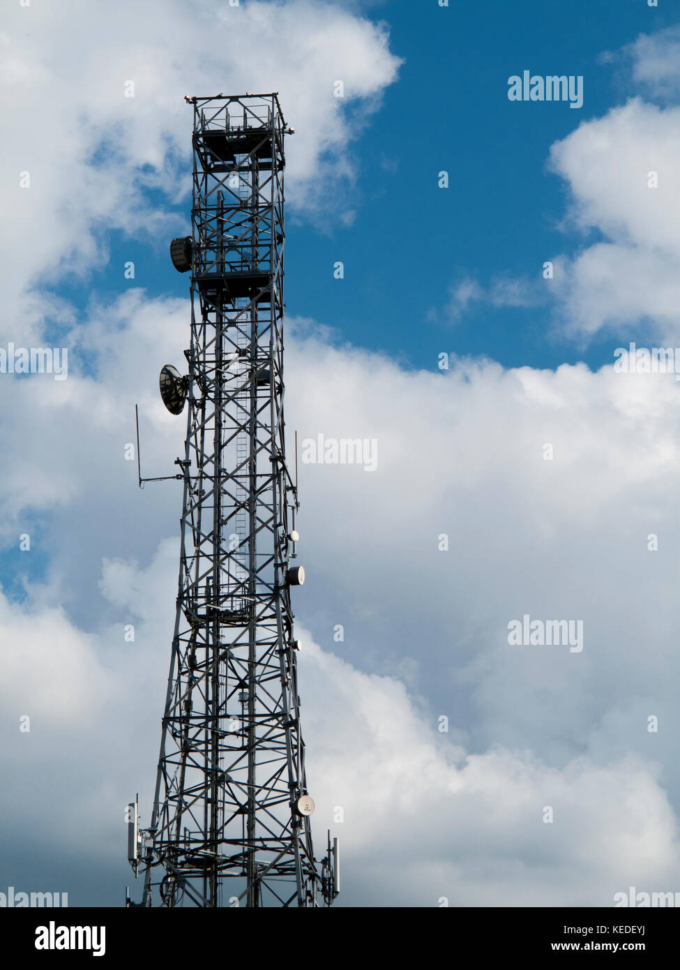 Mobile telephone communications base station tower sited on farmland ...