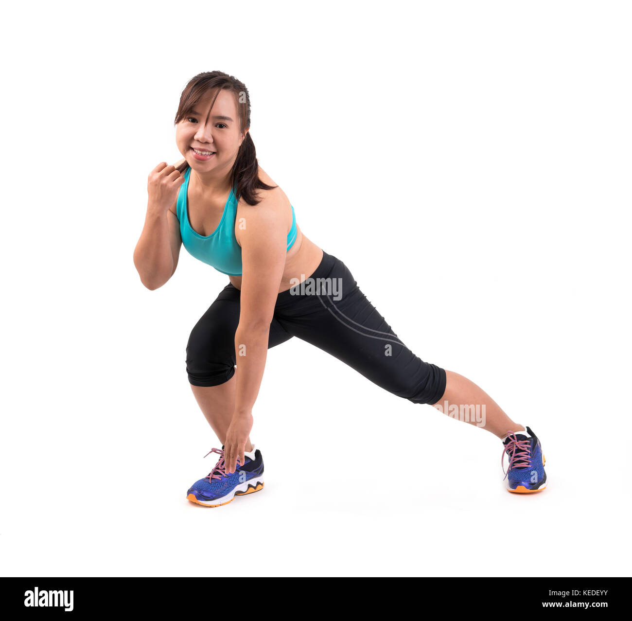 chubby woman doing fitness on white background Stock Photo - Alamy