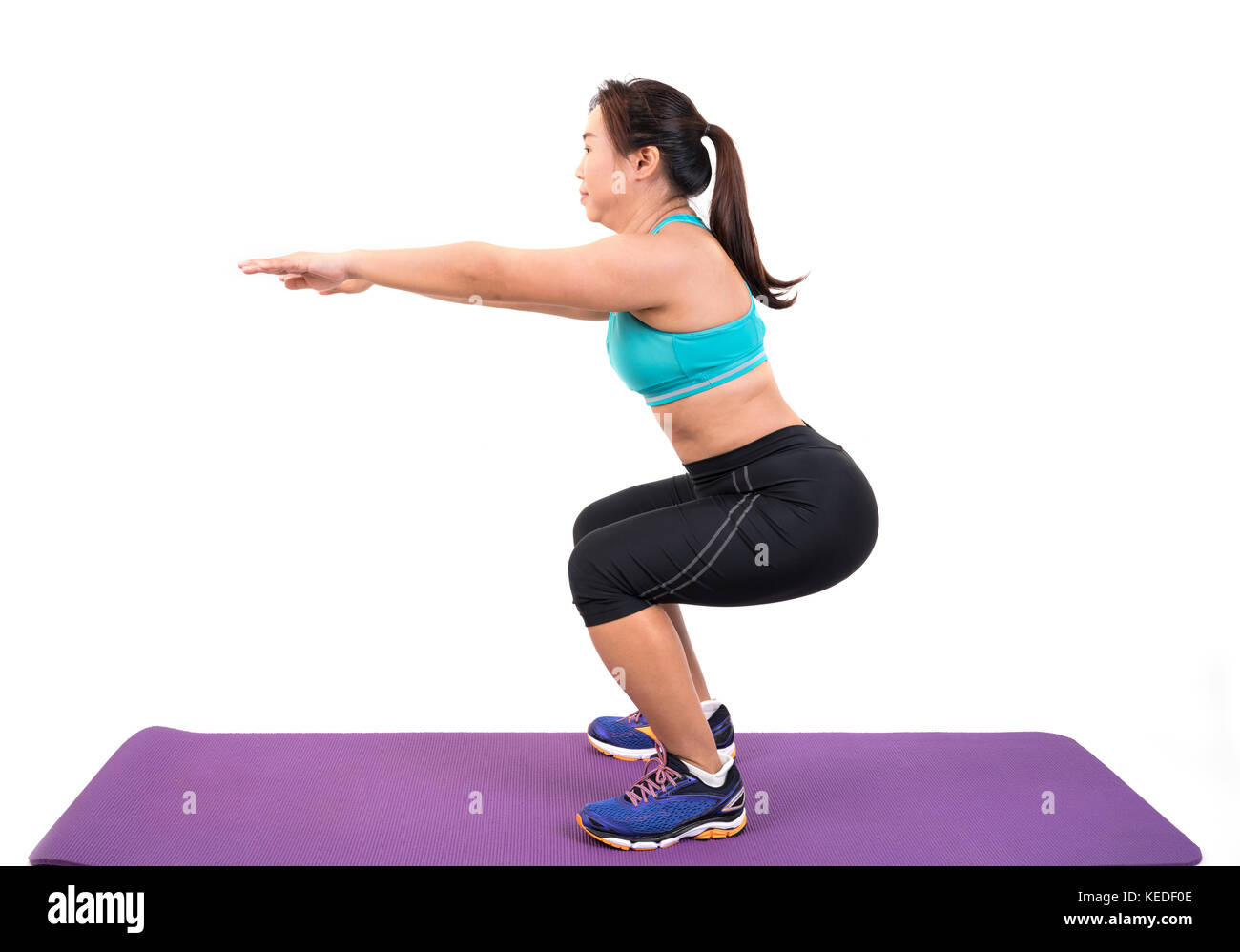 chubby woman doing fitness on white background Stock Photo - Alamy