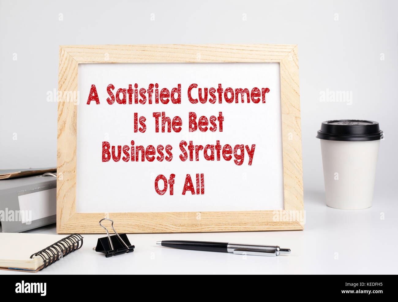 A Satisfied Customer Is The Best Business Strategy of All. Office table ...
