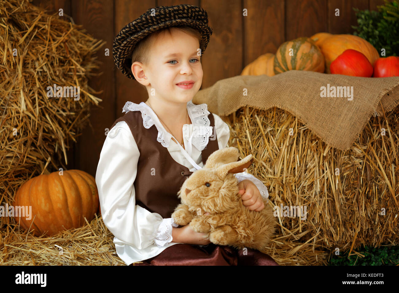 cute little european boy in the cap with blue eyes and bunny Stock ...