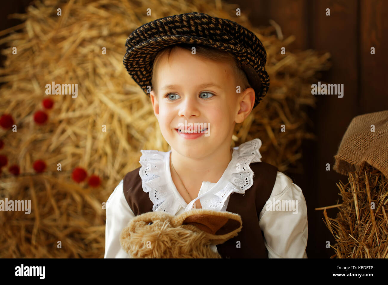 cute little european boy in the cap with blue eyes and bunny Stock ...
