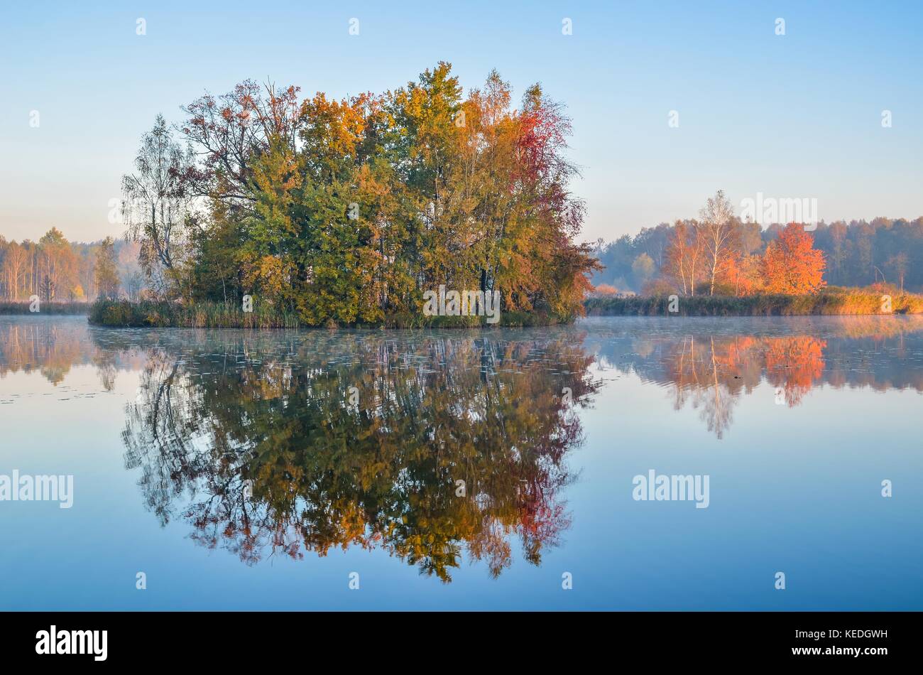 Beautiful autumn landscape. Small island with trees on the lake Stock ...
