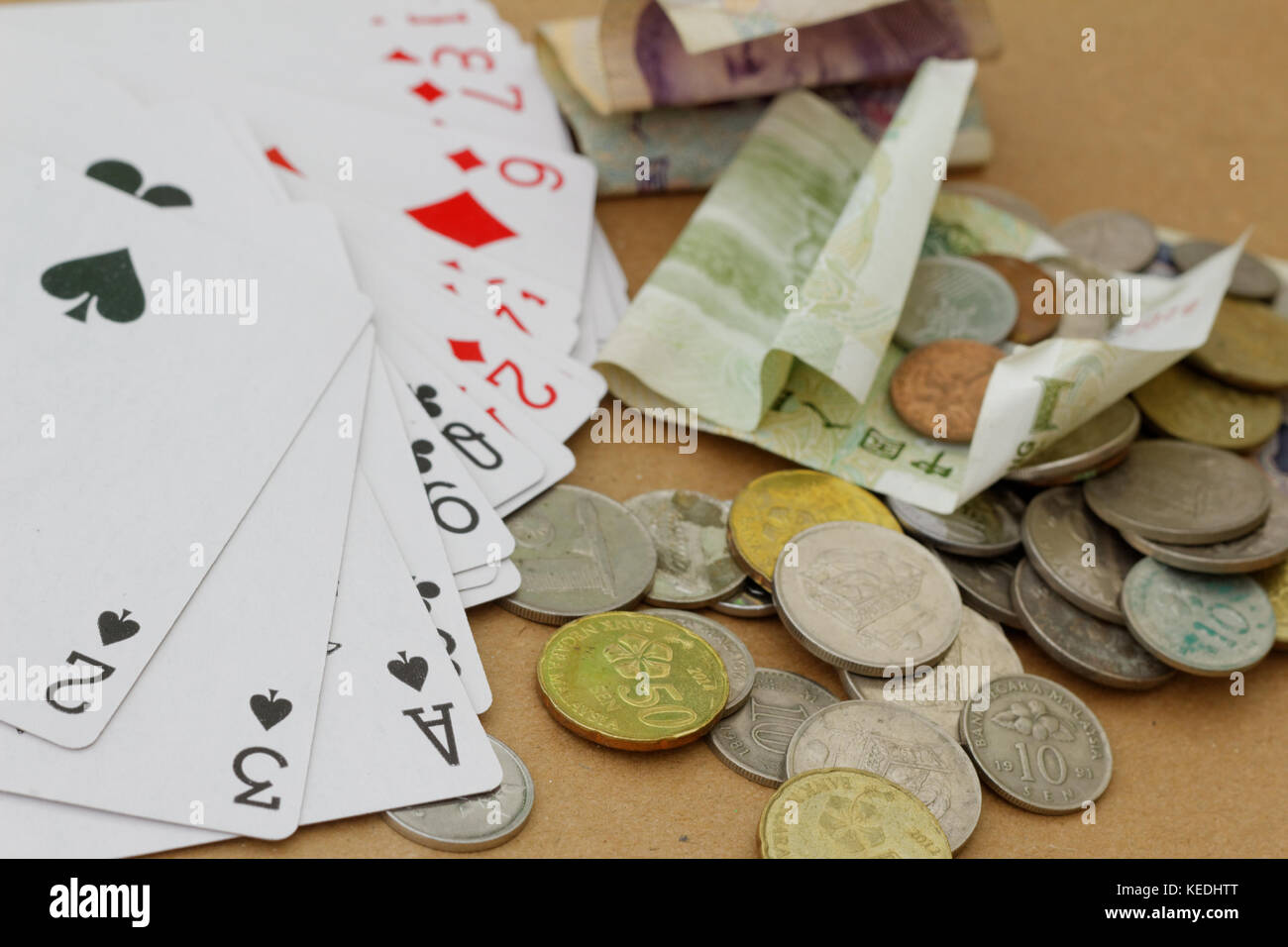 Playing cards and money in different currency. Concept of gambling ...
