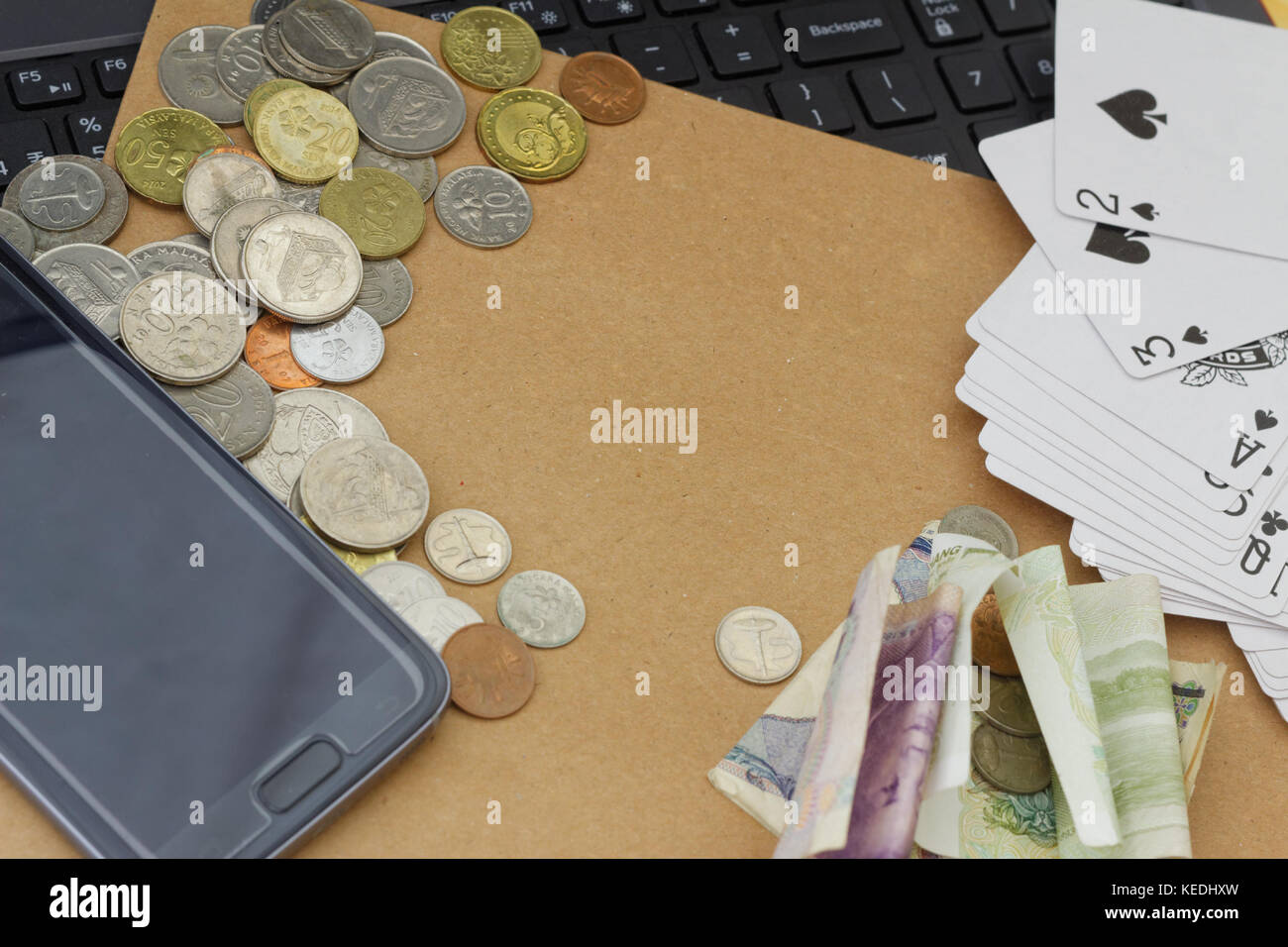 Playing cards, laptop, smart phone and money. Copy space and background ...