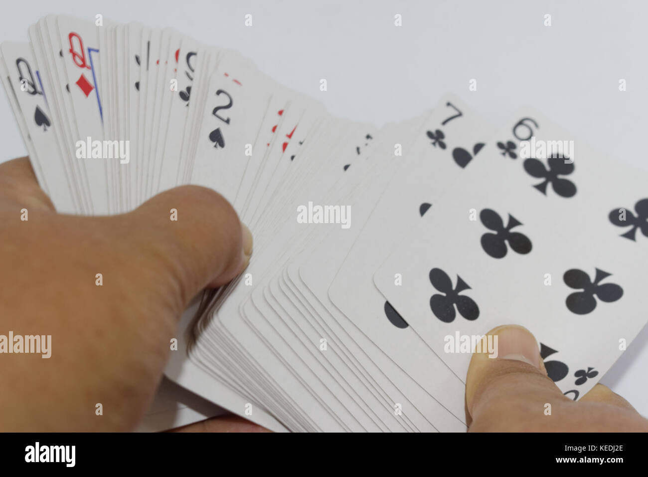 Hand playing card games on isolated background Stock Photo - Alamy