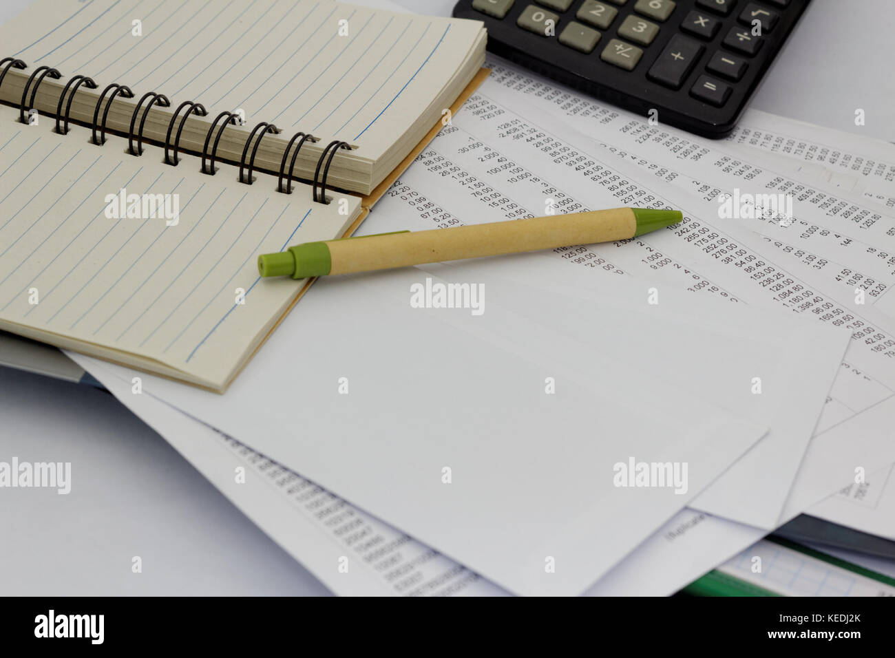 Finance,auditing and accounting concept. Opened black noteboook, papers ...