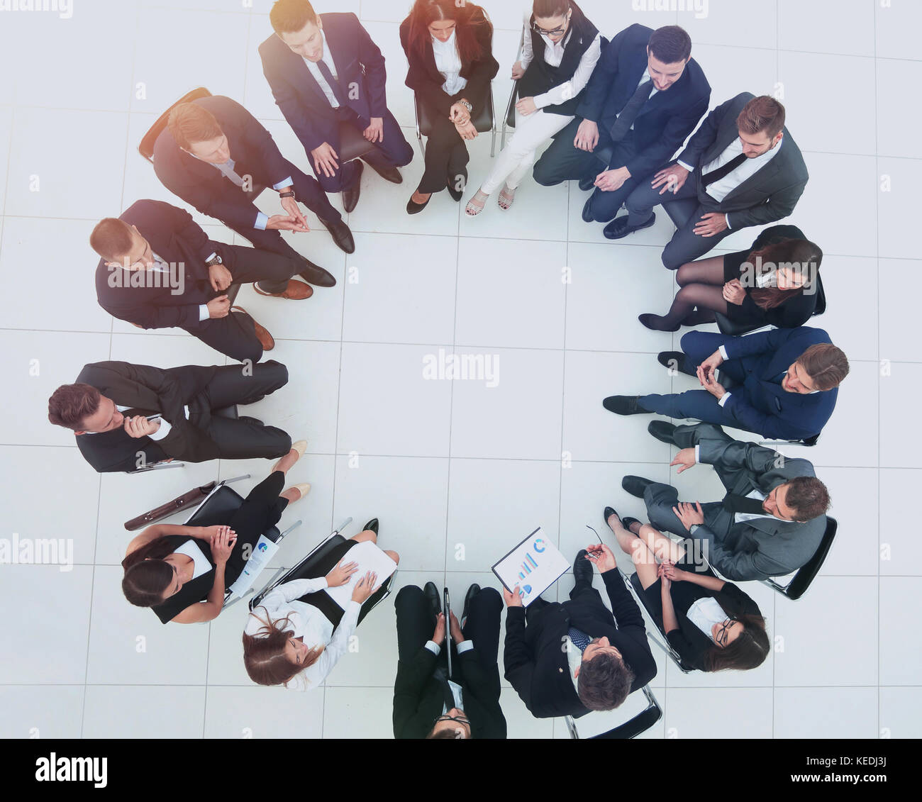 Happy business team pointing at something Stock Photo - Alamy