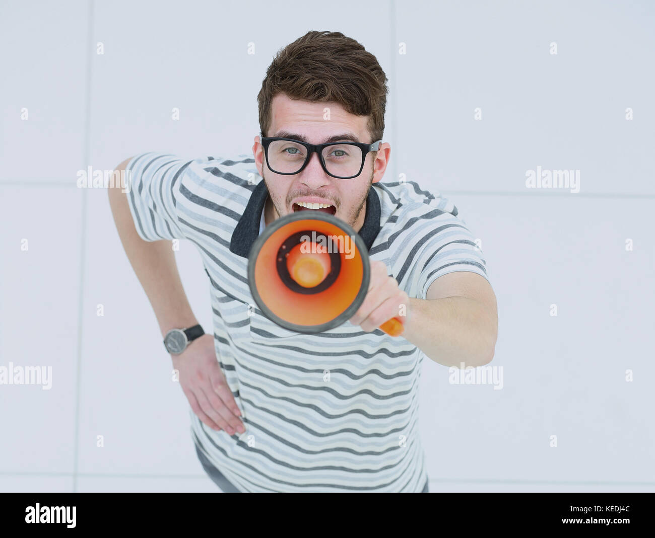 View from above of a happy young man screaming into a megaphone Stock ...