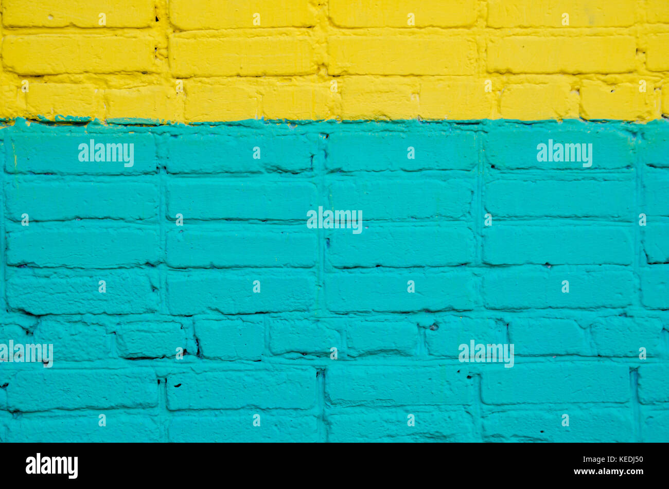 brick wall painted wit color. saturated color Stock Photo - Alamy