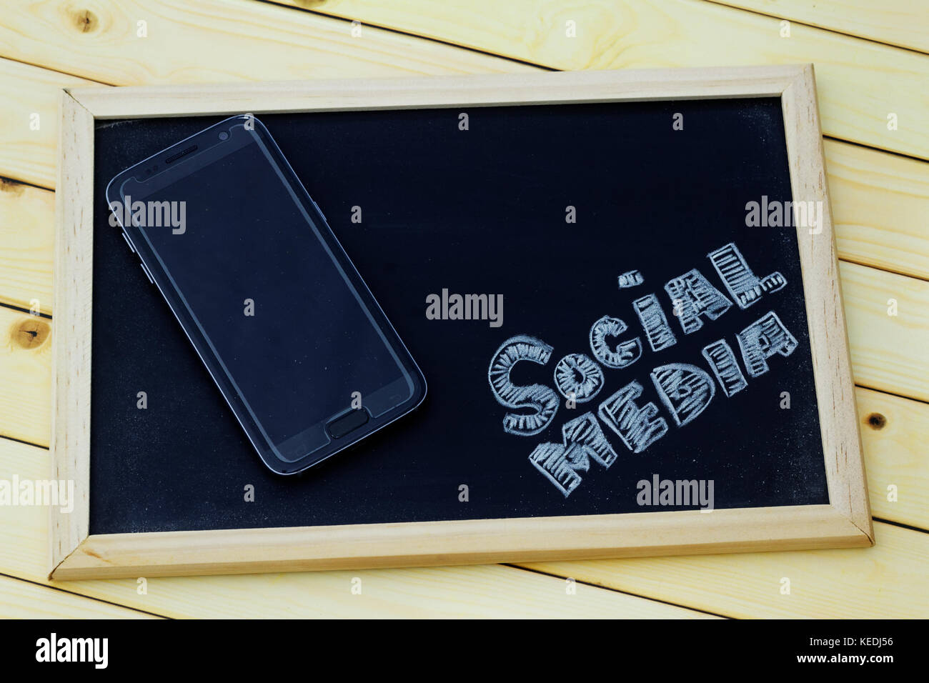 Social media concept with smartphone and word SOCIAL MEDIA written on ...