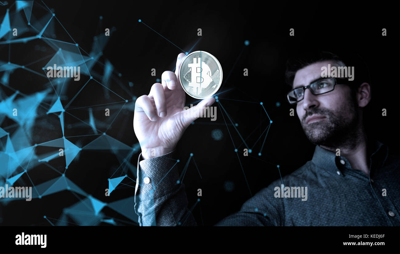 Man touching digital bitcoin Stock Photo - Alamy