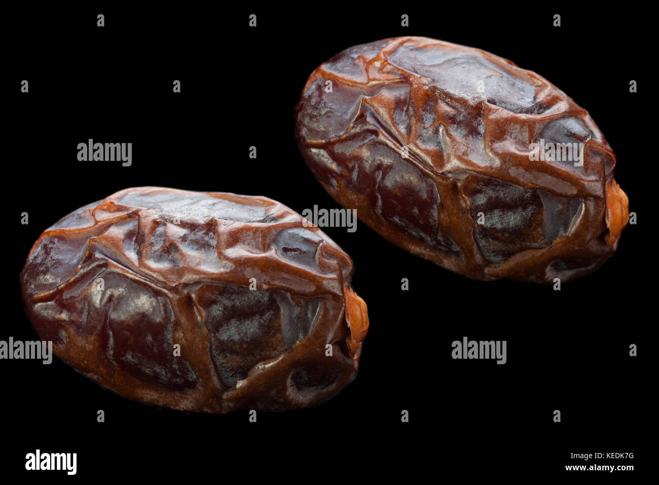Sweet dried date fruit isolated on black background Stock Photo - Alamy