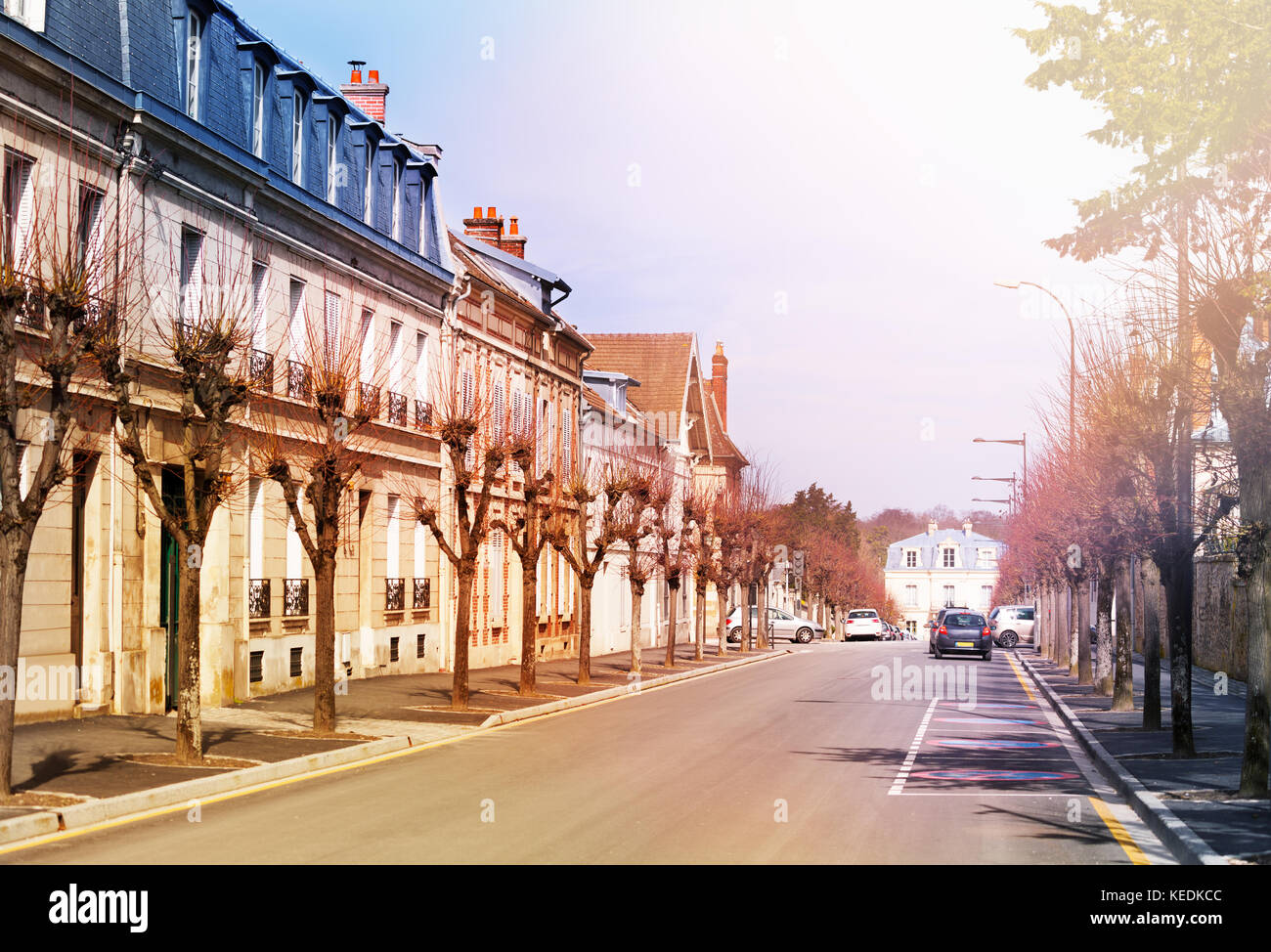 Romantic cityscape of Chantilly with old houses on both sides of road ...