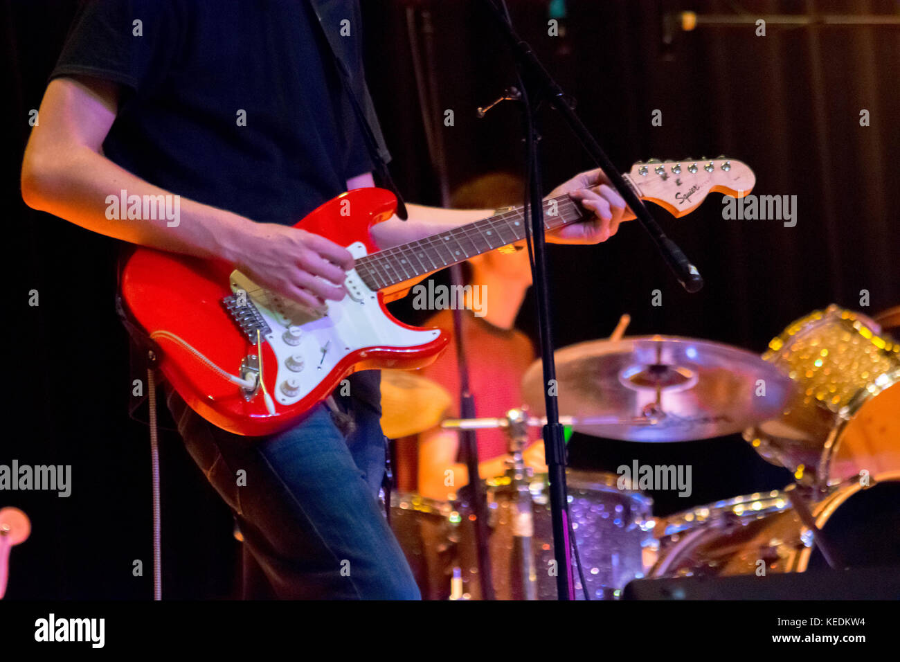 Man Playing a Guitar on Stage Stock Photo - Alamy