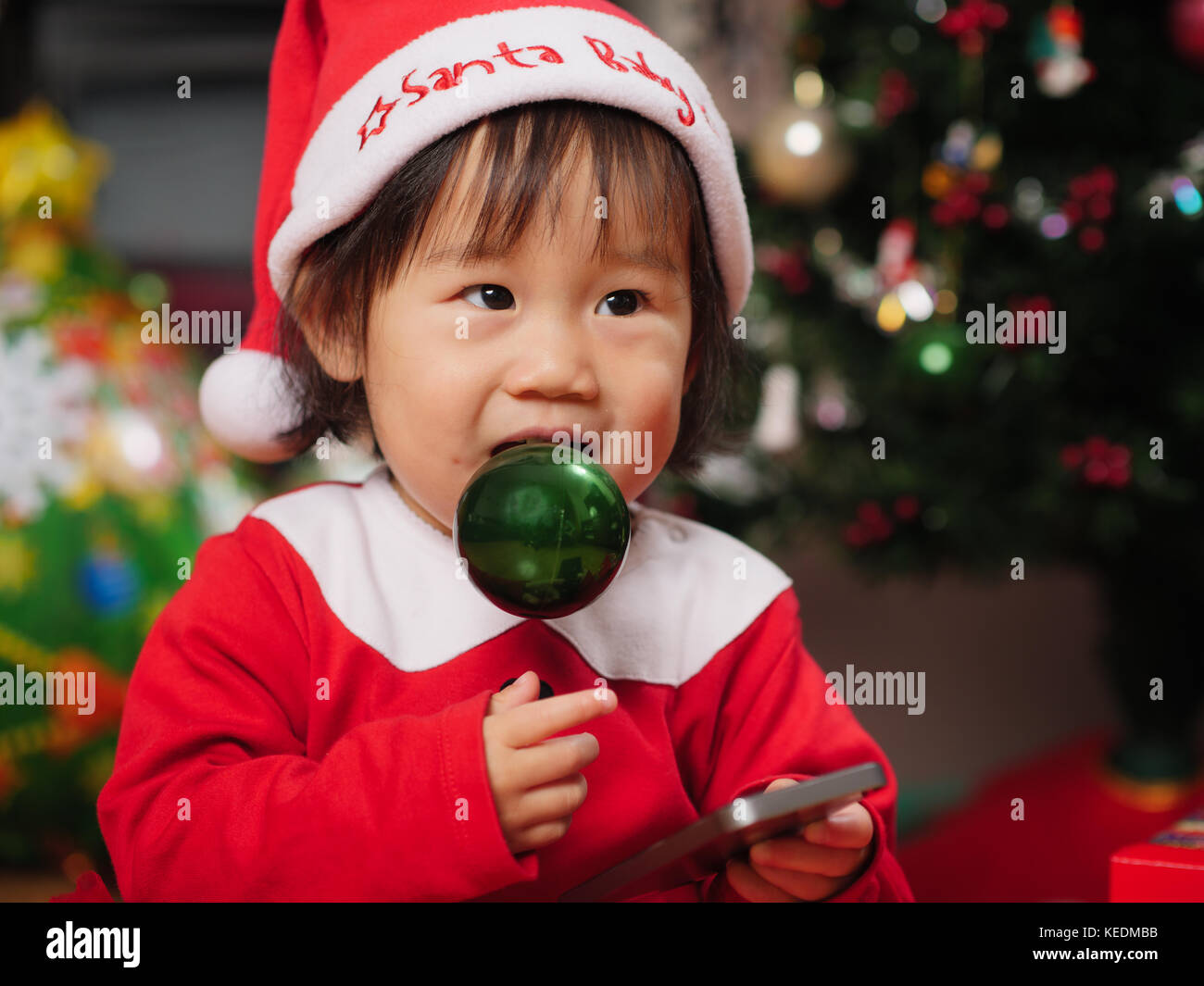 Happy santa baby girl Stock Photo - Alamy