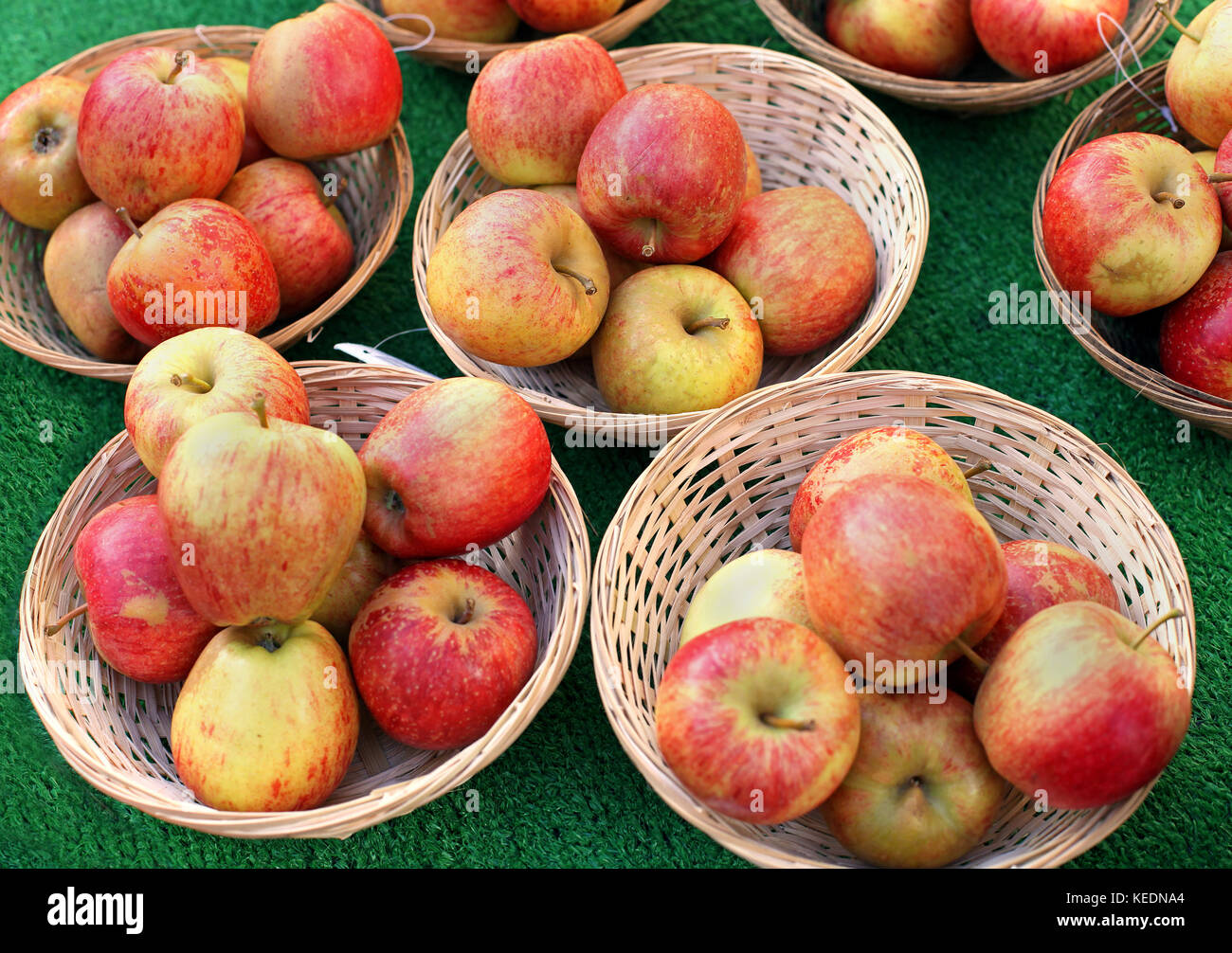 Bunch of fresh organic apples in rattan baskets Stock Photo - Alamy