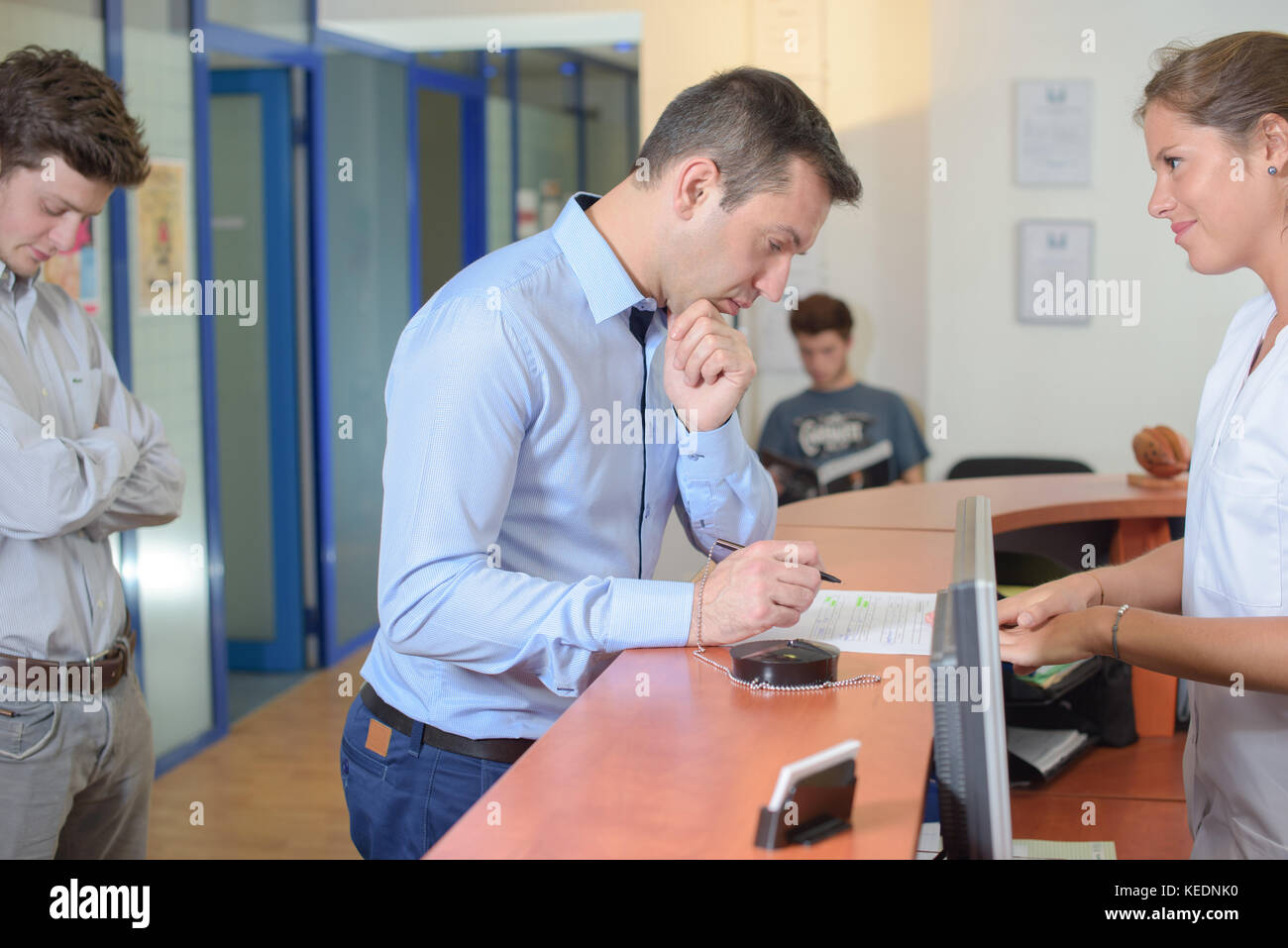 Filling out a form at meeting hi-res stock photography and images - Alamy