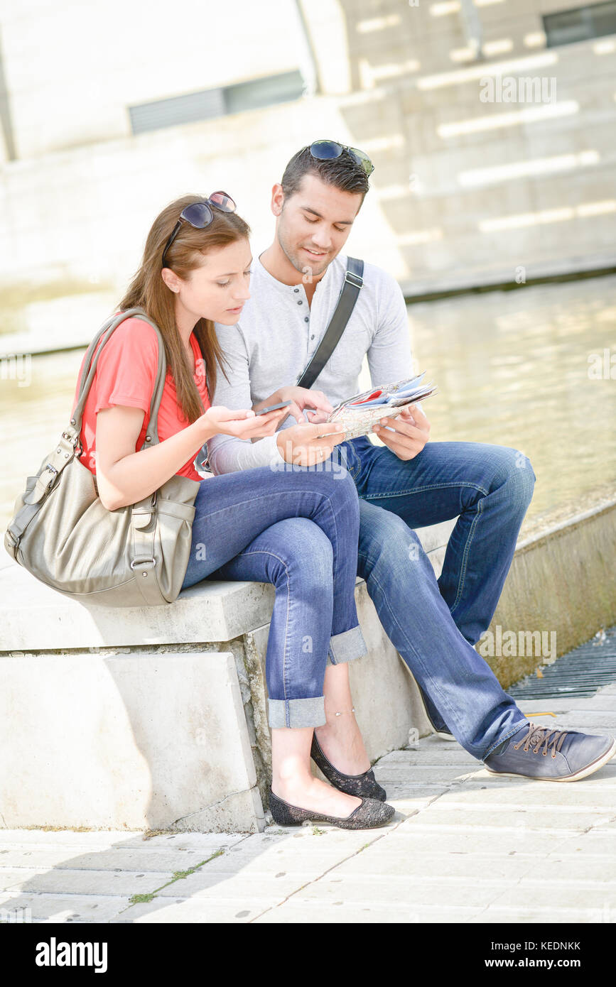 Couple sat down Stock Photo - Alamy