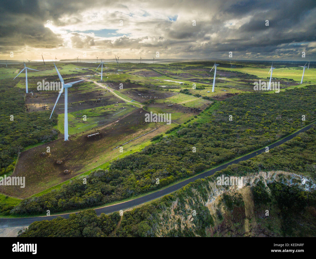 Aerial panorama of beautiful stormy clouds above wind turbines and ...