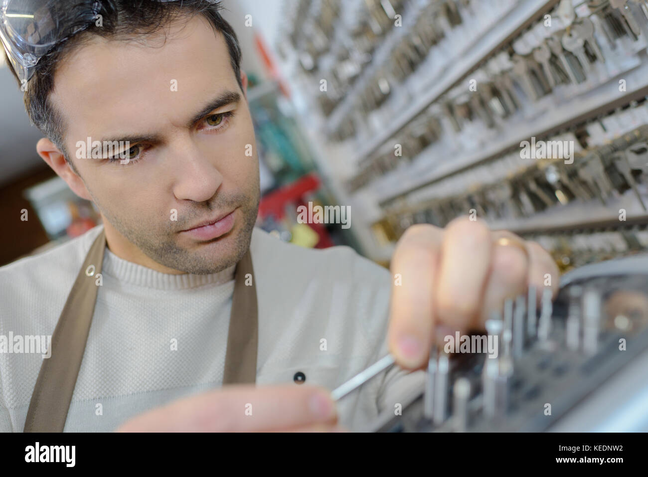 locksmith making a new key Stock Photo - Alamy