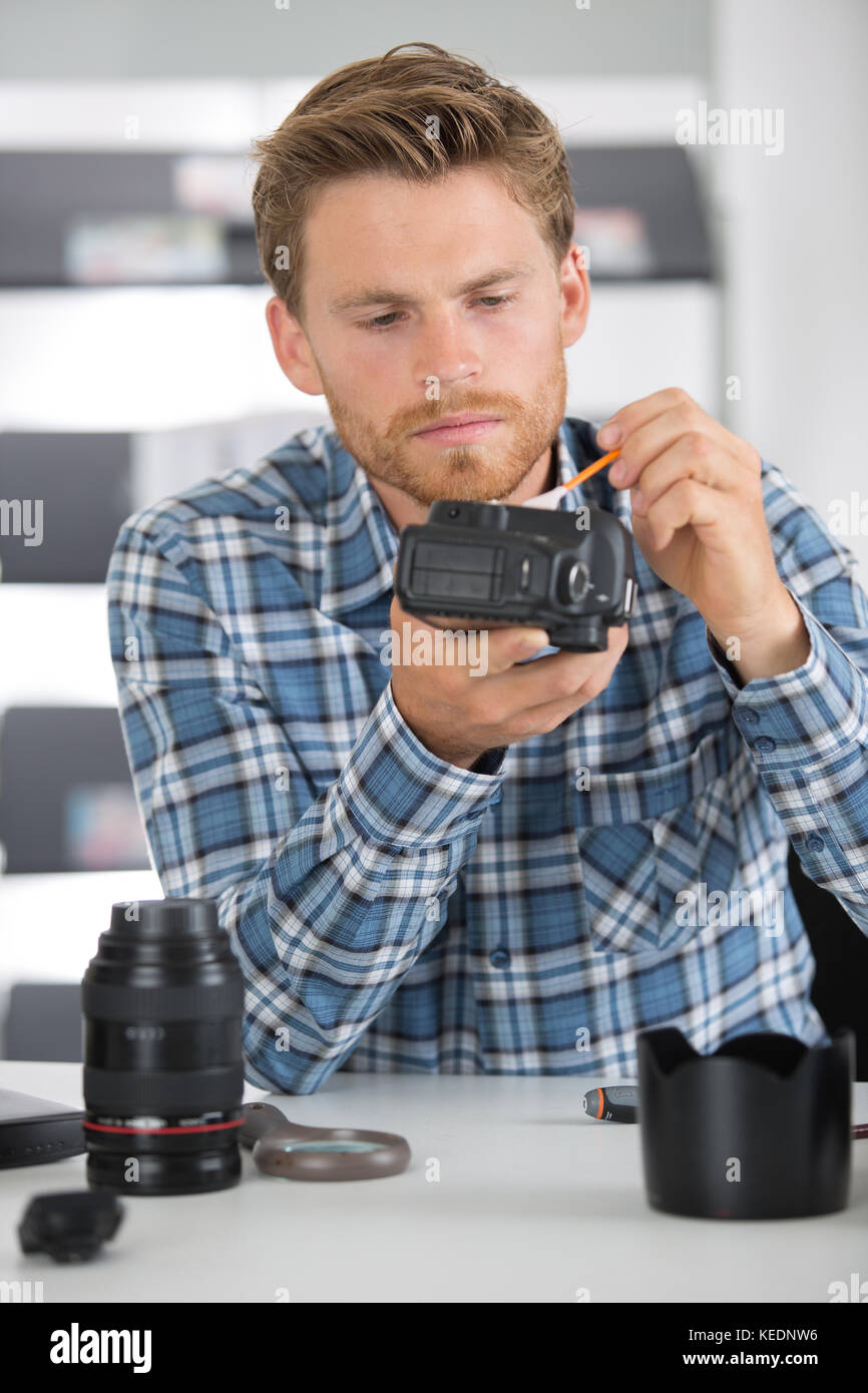 photographer using lens cleaning brush pen Stock Photo - Alamy