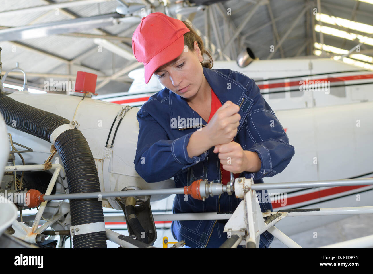 female engineer maintenance repairs airplaine Stock Photo - Alamy
