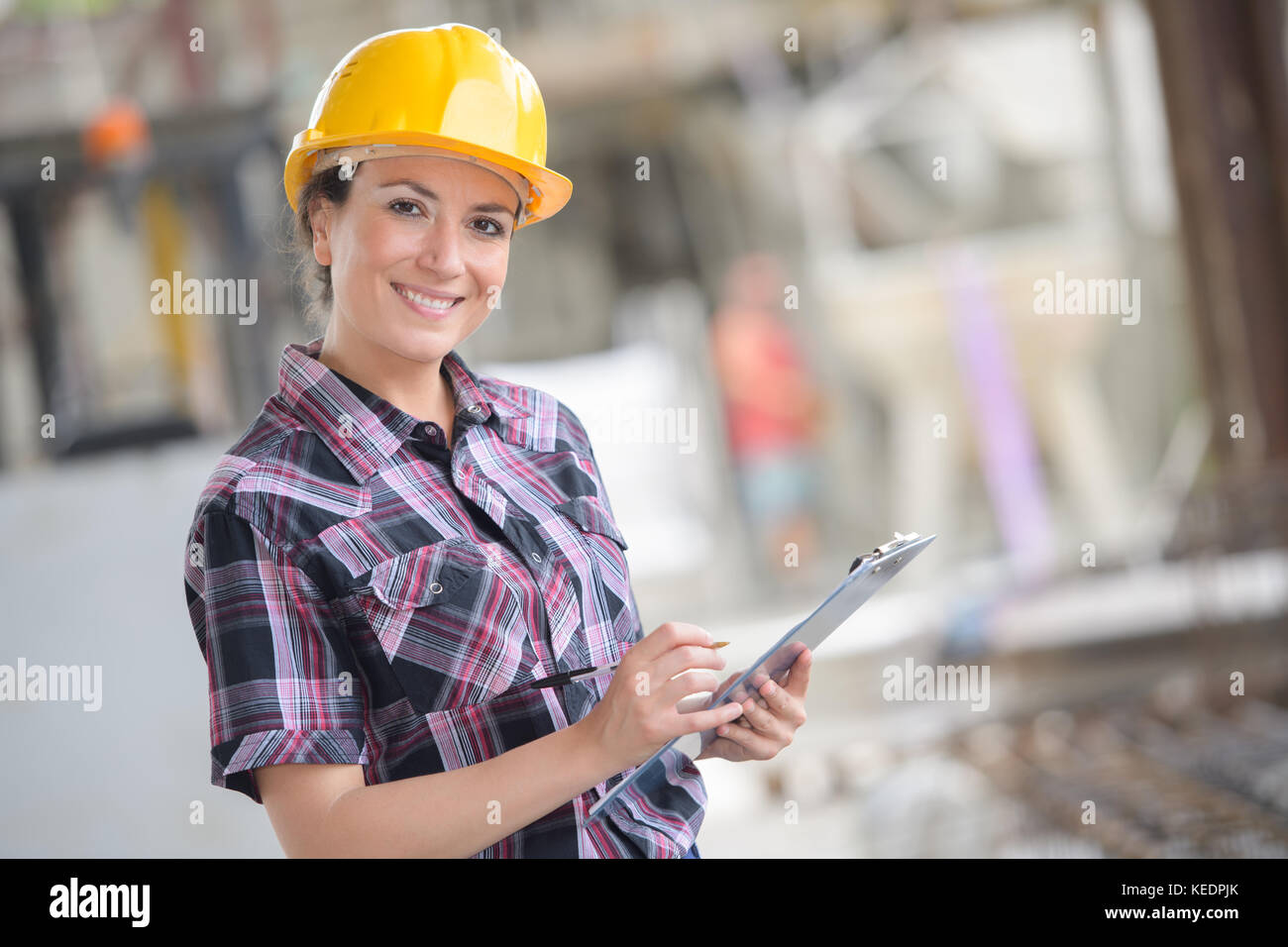 mechanical engineer taking notes at metallurgy factory Stock Photo - Alamy