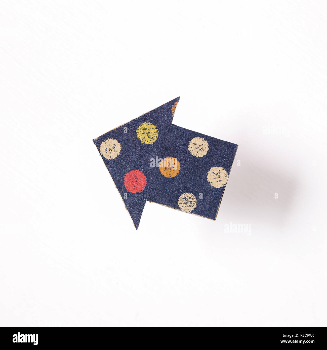 Arrow shaped paper on white background Stock Photo - Alamy