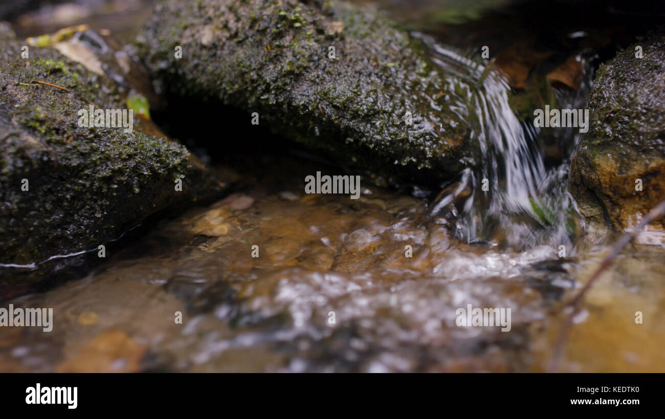 Water splash in river. Water in river close up with bubbles. Water ...