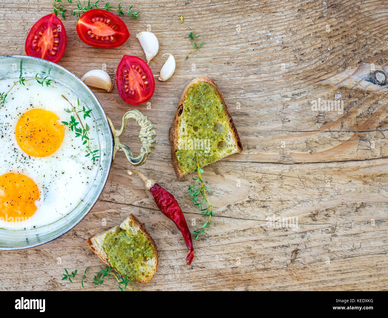Breakfast set with fried egg on a wooden desk Stock Photo - Alamy