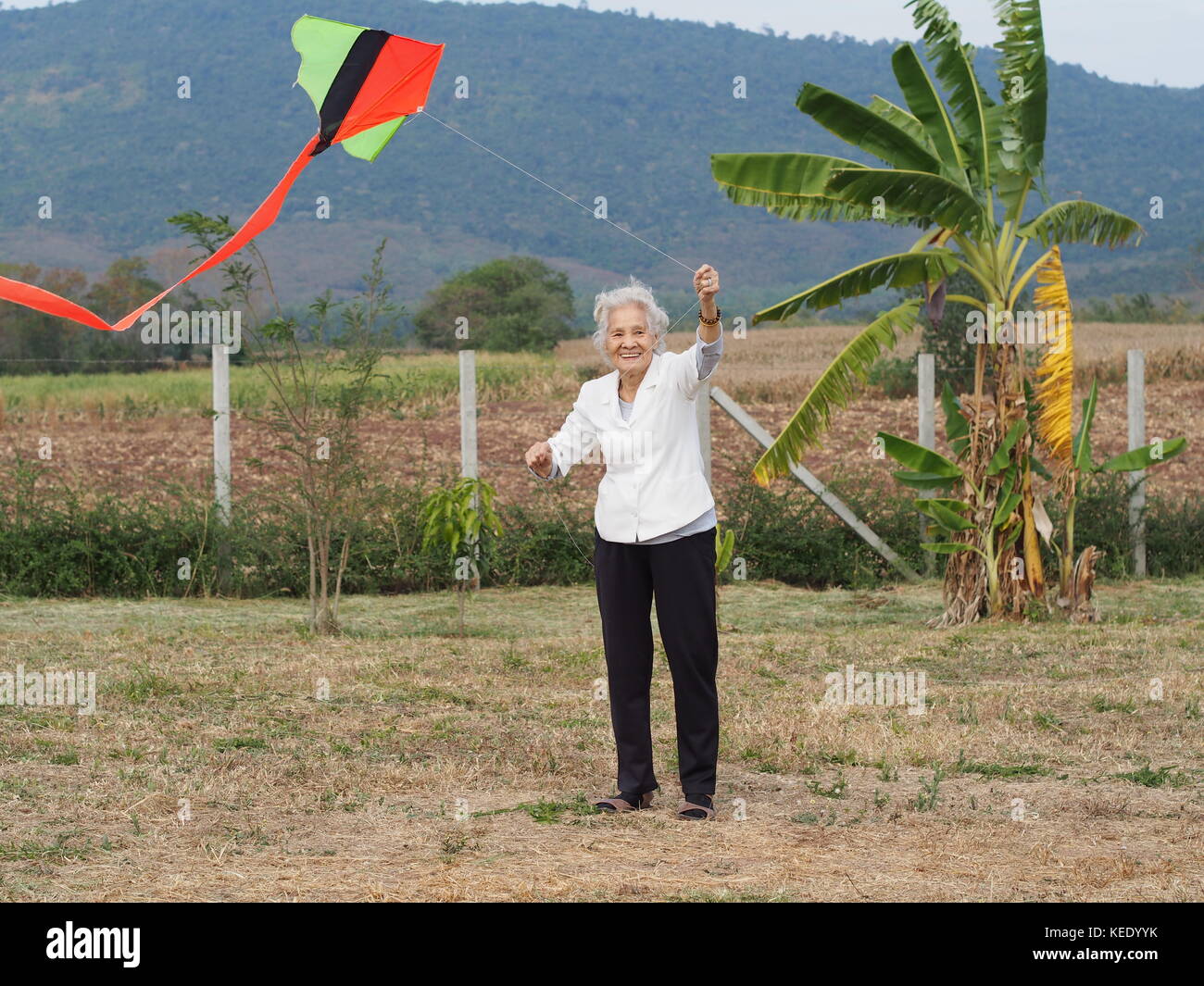 Healthy Asian senior woman enjoying her day outdoors Stock Photo - Alamy
