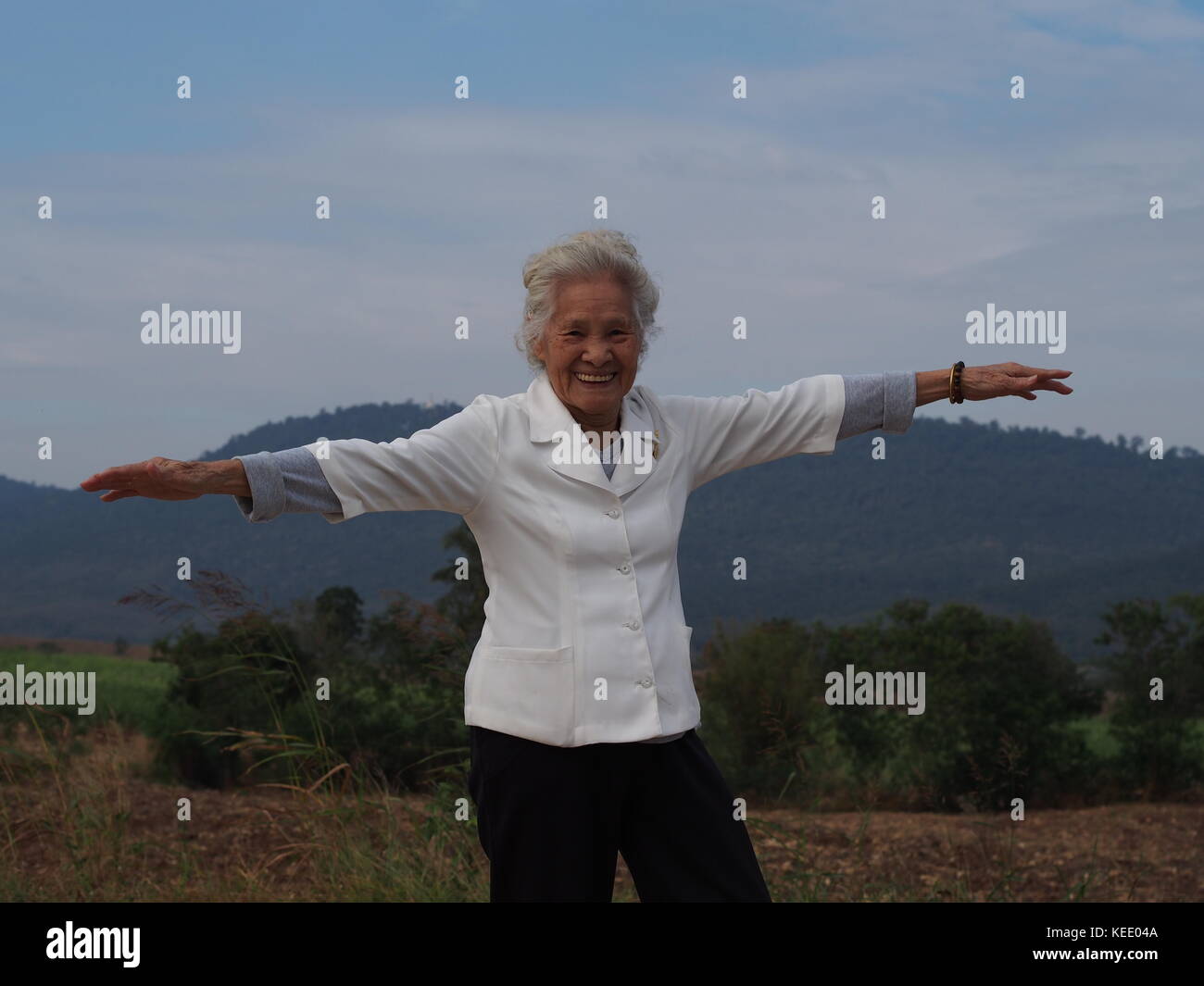 Healthy Asian senior woman enjoying her day outdoors Stock Photo - Alamy