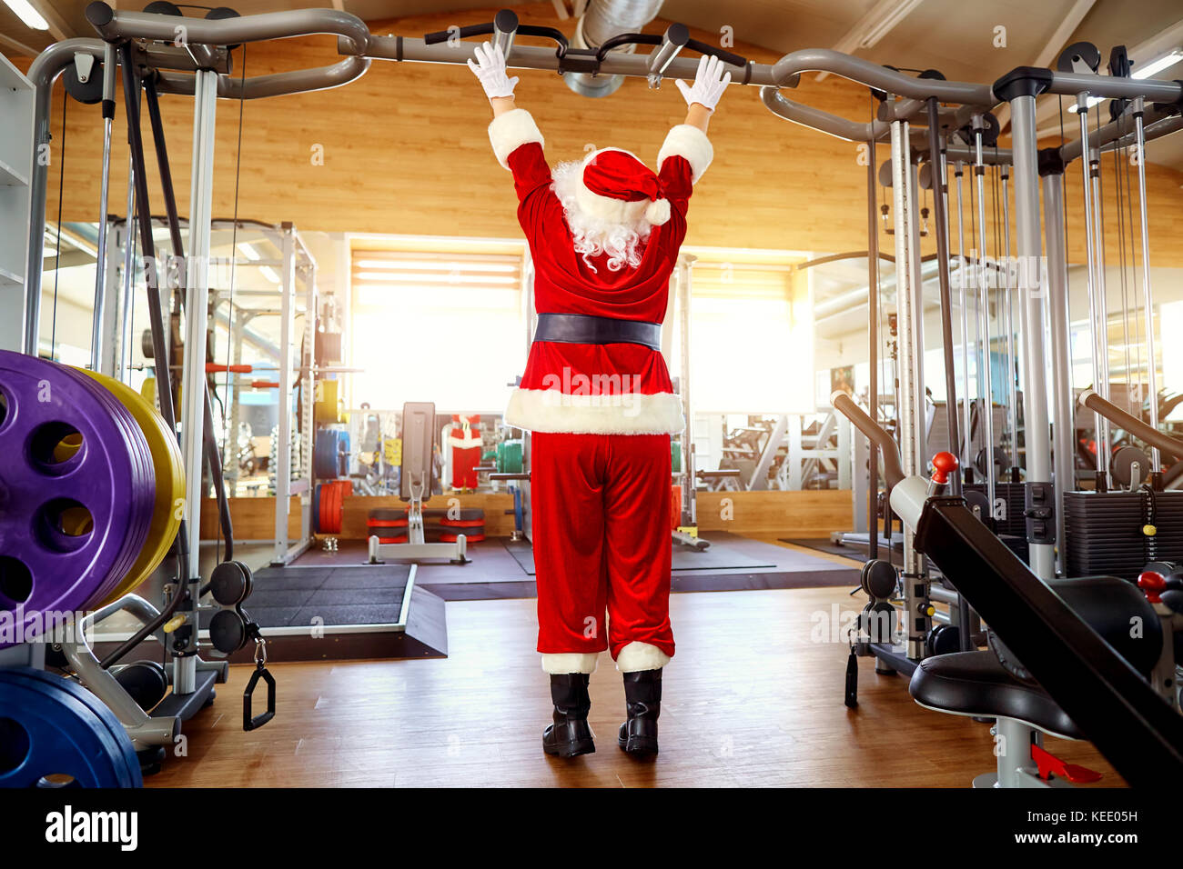Santa Claus in the gym doing the exercises Stock Photo - Alamy