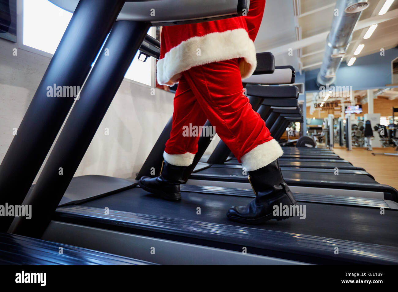 Santa Claus in the gym doing exercises Stock Photo - Alamy