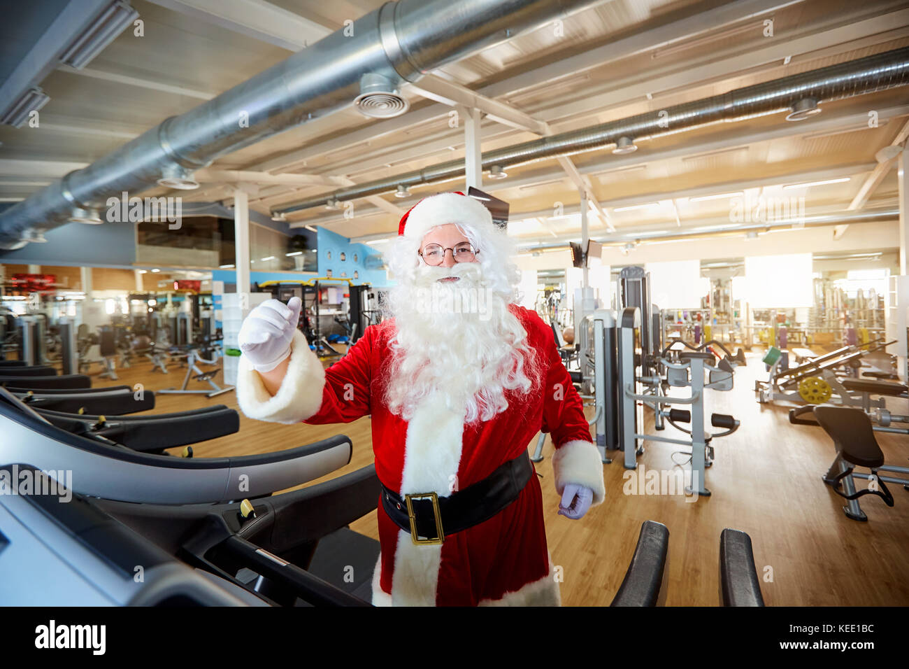 Santa Claus in the gym doing exercises Stock Photo - Alamy