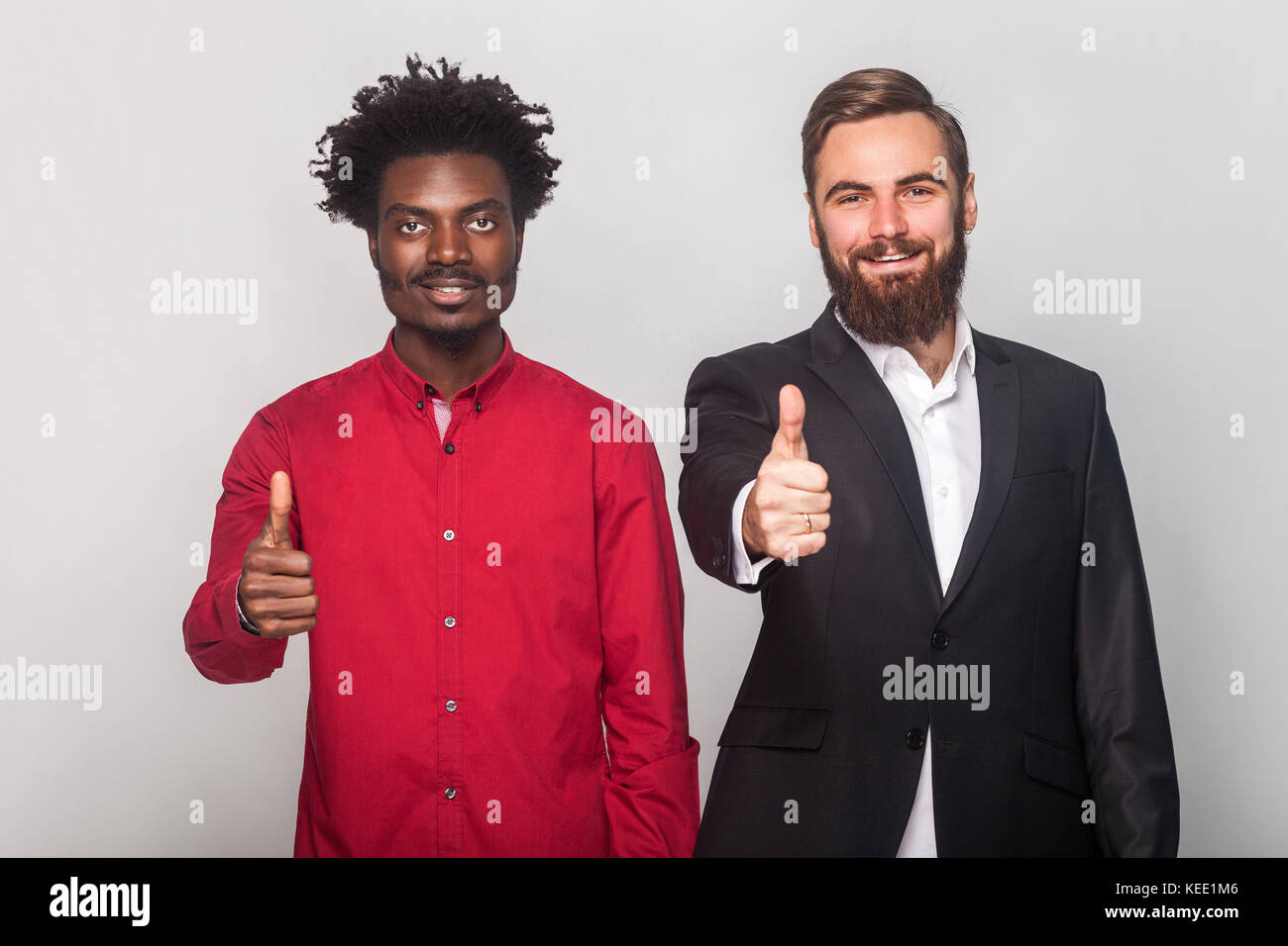 Businessman showing at camera like sign and smiling. Focus on face ...