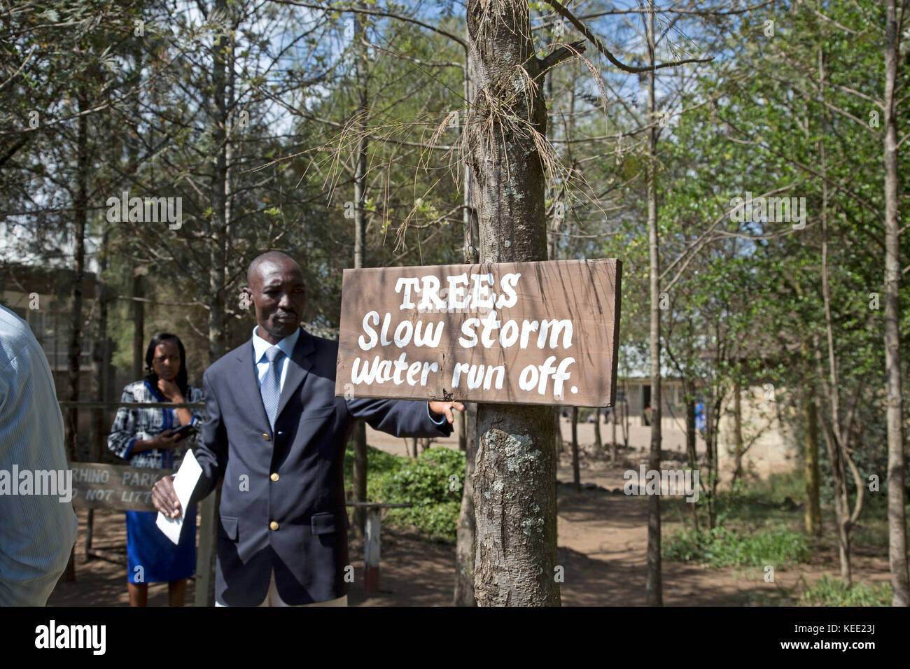 African man sign trees slow water run off Head teacher Anam Echakari ...