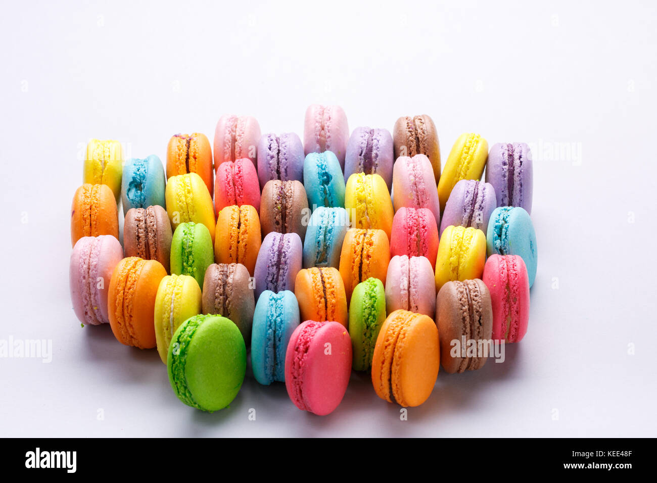 Colorful french macaroons over light gray background. Different ...