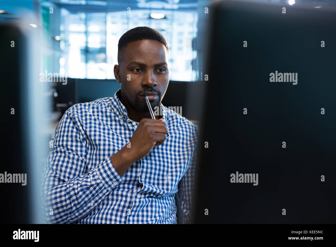 Computer engineer working at desk in office Stock Photo - Alamy