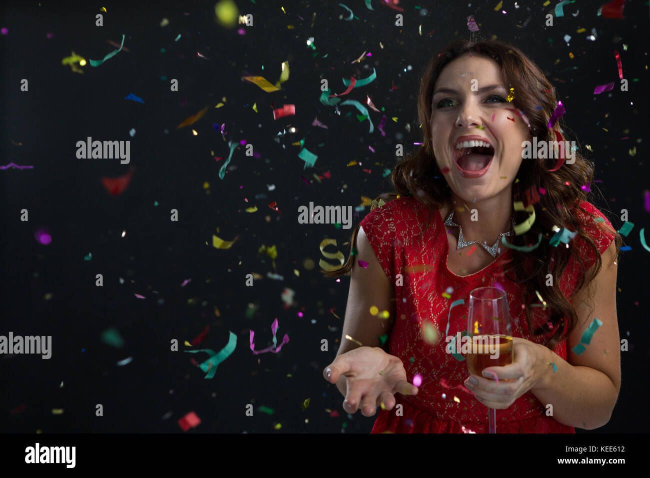Woman celebrating confetti falling hi-res stock photography and images ...