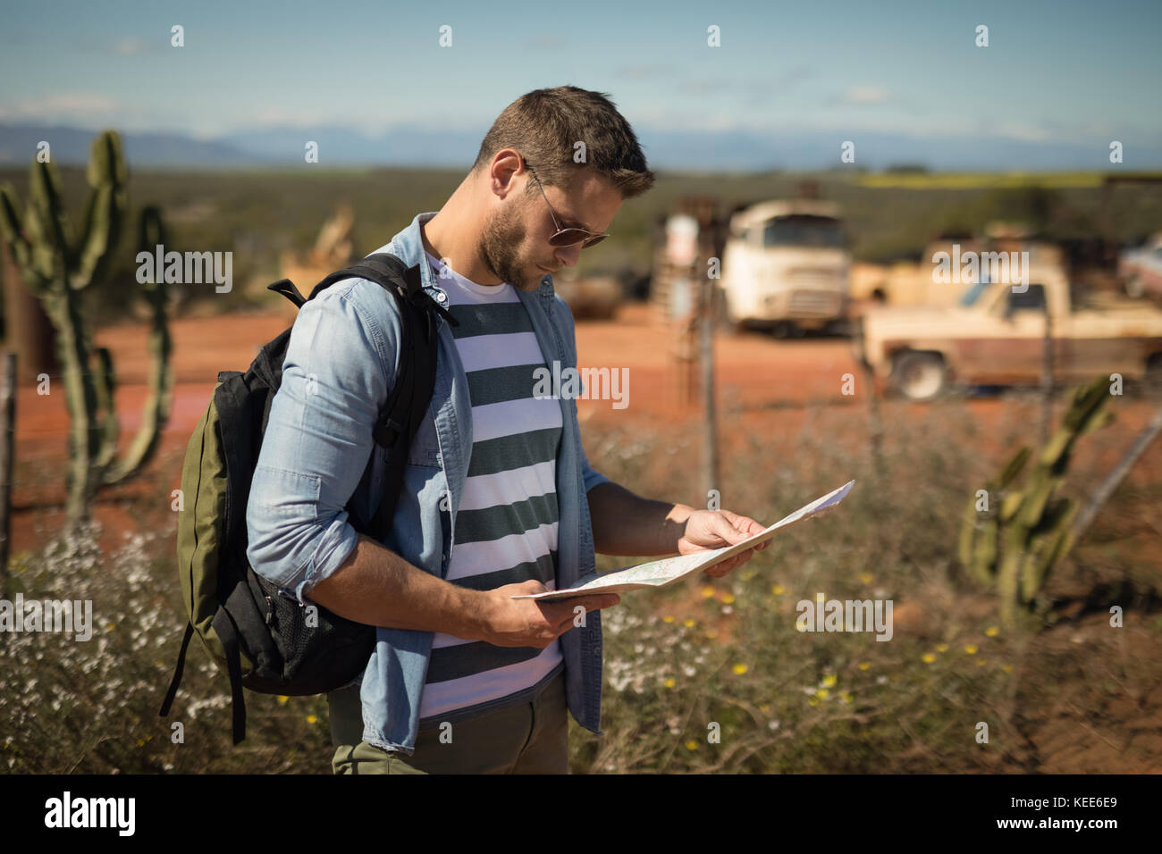 Young man looking at map hi-res stock photography and images - Alamy