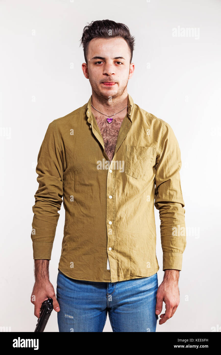 Boy with gun on white background Stock Photo - Alamy