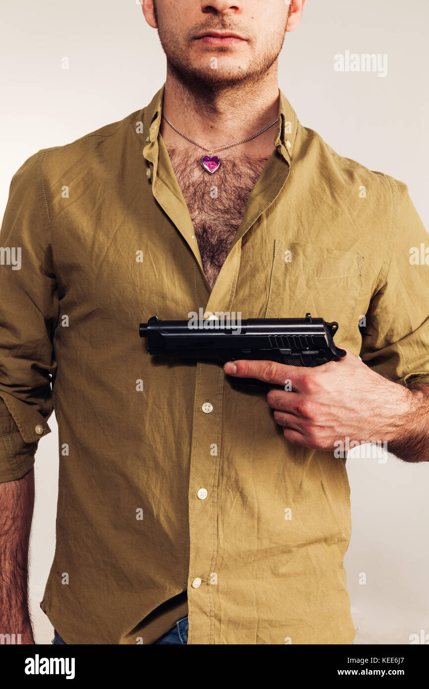 Boy with gun on white background Stock Photo - Alamy