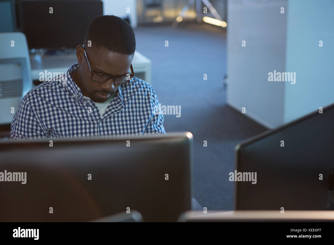 Computer engineer working at desk in office Stock Photo - Alamy